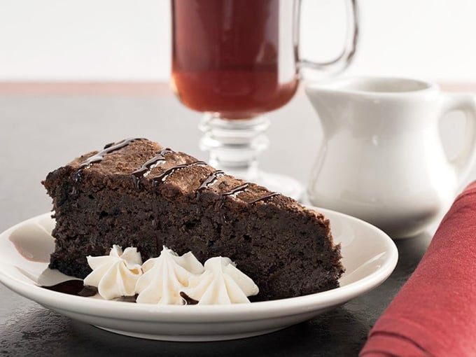 A chocolate cake so dense and rich it should come with its own tax bracket and a warning label for chocolate enthusiasts.