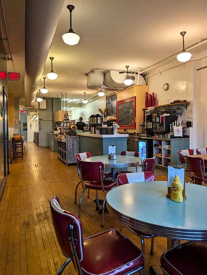 Vintage tables and pendant lights create an atmosphere where time moves slower and tastes better.