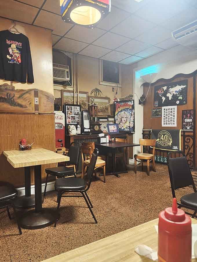 Mismatched chairs and butcher block tables create the kind of comfortable chaos that feels like home instantly.