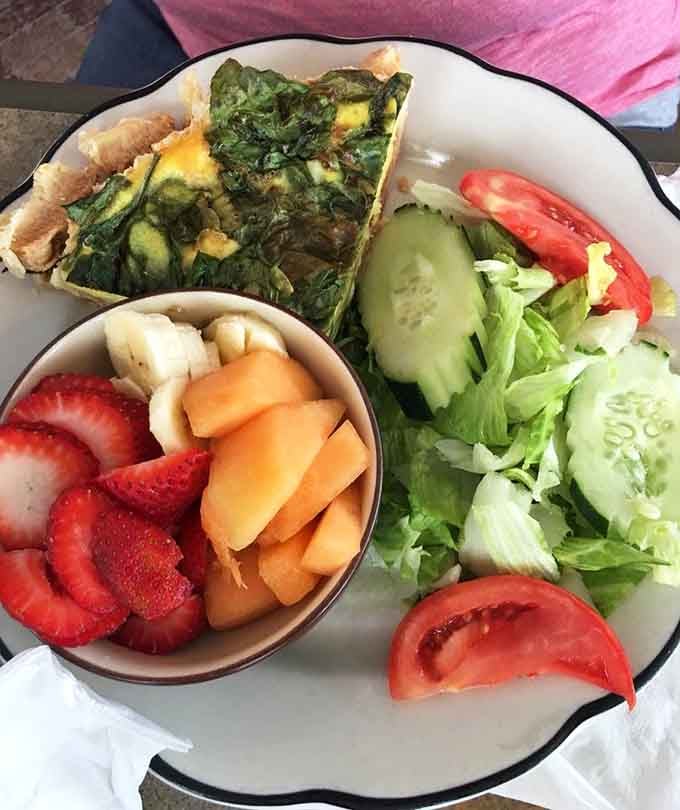 That quiche looks like it wandered in from a fancy brunch spot and decided to stay forever.