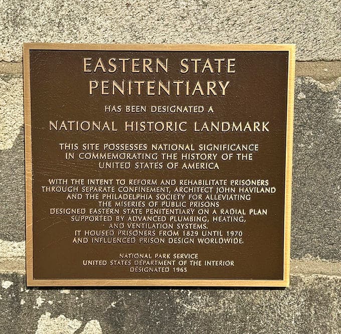 This National Historic Landmark plaque marks a site that influenced prison design worldwide, for better or worse.