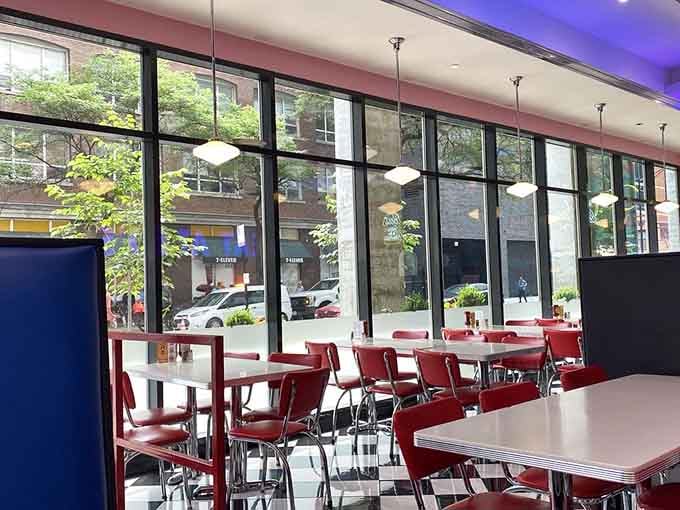 Floor-to-ceiling windows let natural light pour in, proving that even retro diners appreciate a little modern sunshine and brightness.