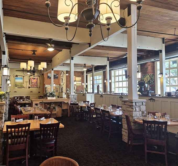 The dining room flows naturally with its mix of seating options, proving that thoughtful design makes everyone feel welcome here.