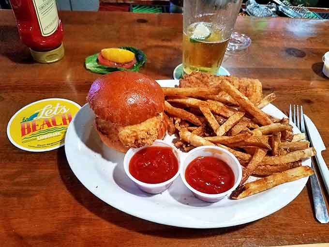 A sandwich that requires both hands and several napkins&mdash;crispy fried fish on a soft bun with just the right amount of tangy sauce.