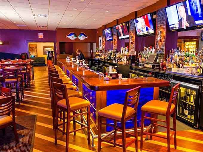 The bar area glows invitingly with amber lighting, ready to pour you something cold after that bridge crossing.