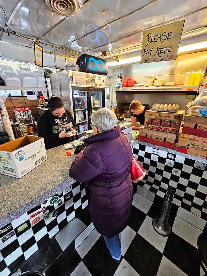 That "Please Pay Here" sign says it all—cash only, no fuss, just good food and honest service.