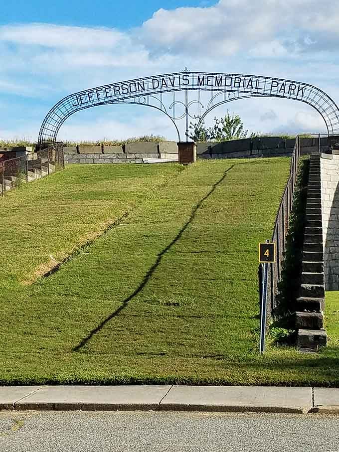 Jefferson Davis Memorial Park's grassy slopes roll toward the ramparts, where Confederate and Union history collide in peaceful contemplation.