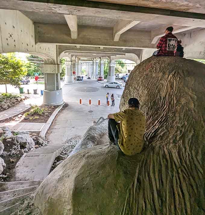 Climbing on the troll is practically mandatory, though he looks slightly tired of the whole situation.
