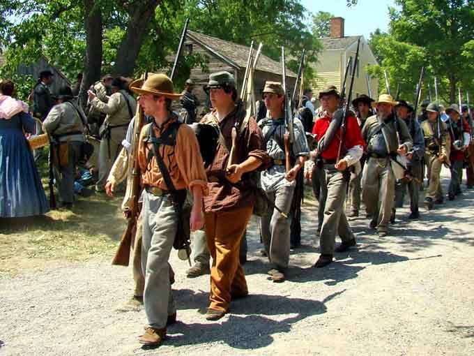 Civil War reenactors march through the village, bringing history to life with impressive dedication and authentic facial hair.