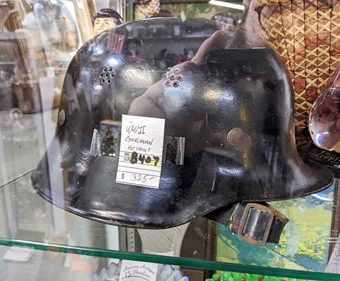 WWII German helmet resting in a display case, a sobering piece of history that collectors and museums take very seriously indeed.