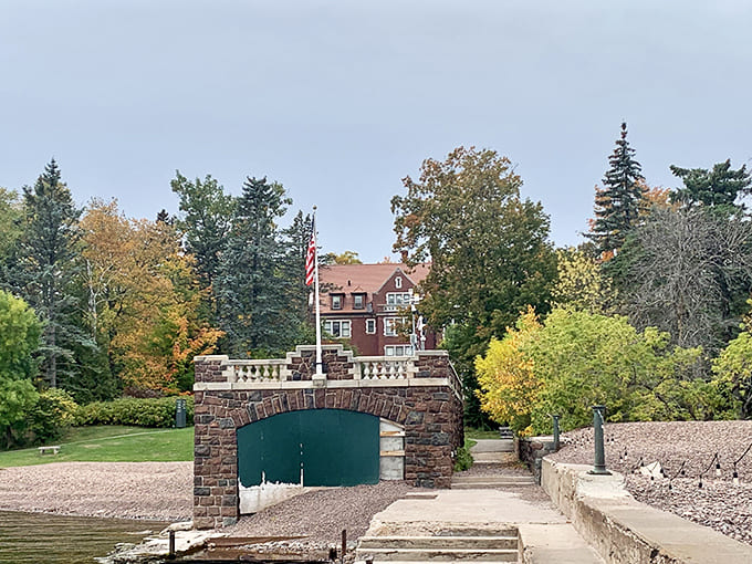 The boathouse entrance frames the mansion perfectly, reminding visitors that Lake Superior was the family's front yard.