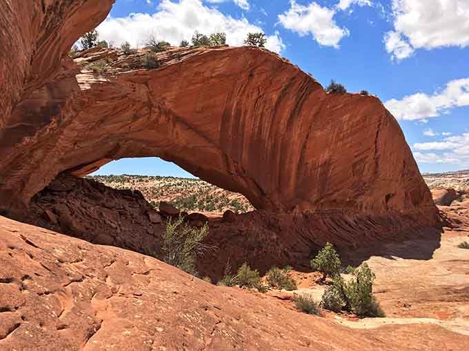 This isn't just a rock arch—it's nature's perfect frame for the endless Utah sky. Stand beneath it and feel wonderfully, magnificently small.