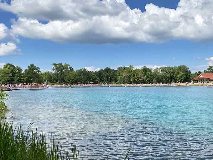 Summer weekends bring families together at this supervised beach where the water color still seems completely impossible.