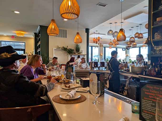 Counter seating offers front-row tickets to the culinary show, complete with pendant lights casting a warm, welcoming glow.