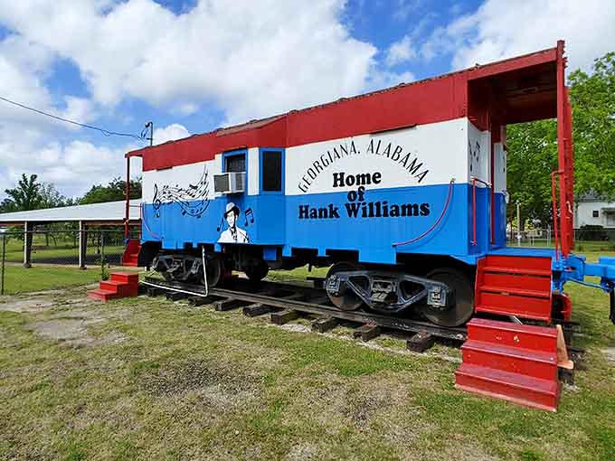 The painted caboose outside adds whimsical charm while nodding to the traveling life of a touring country music star.