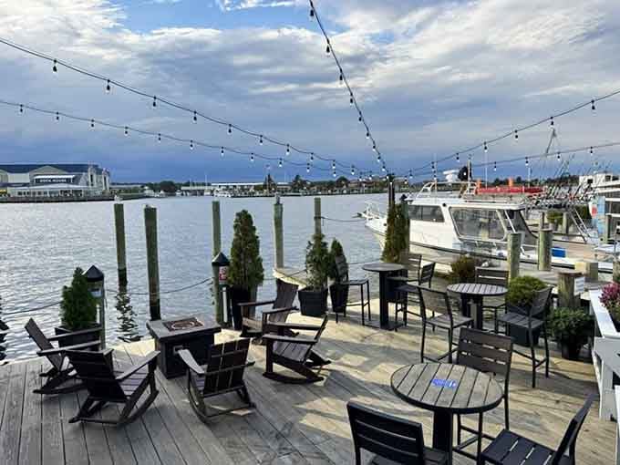 Waterfront seating with string lights overhead transforms dinner into an evening you'll remember for years to come.