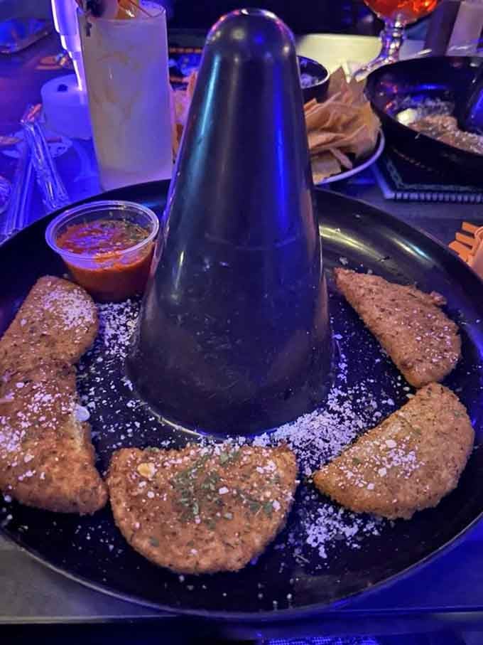 Half moon mozzarella sticks arranged around a cone of dipping sauce create an appetizer that's almost too pretty to eat.