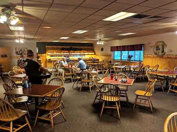 Windsor-style chairs and red tablecloths create that timeless diner atmosphere where everyone feels like family here.