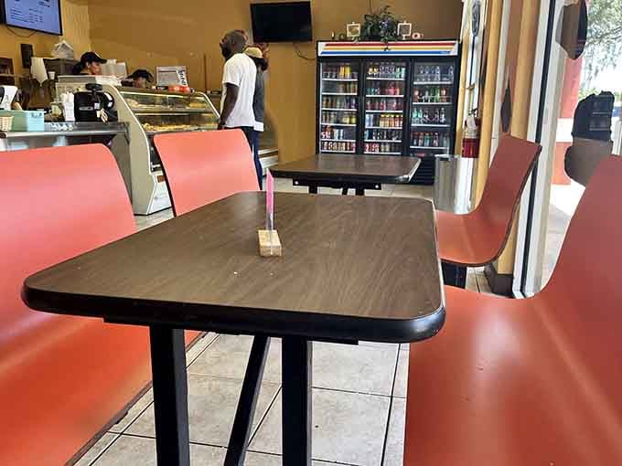 Simple seating for those who can't wait until they get home, with pink chairs adding unexpected cheerfulness.