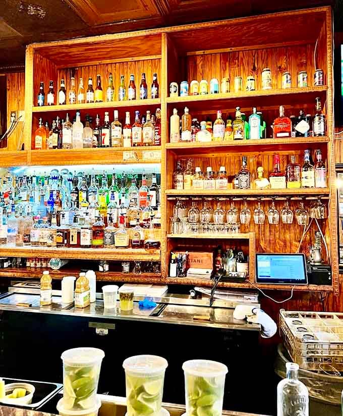 Behind the bar, bottles and fresh drinks await to complement your meal with liquid refreshment and cheer.