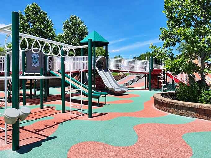Shaded seating areas where exhausted grandparents can rest while pretending they're still watching every move.