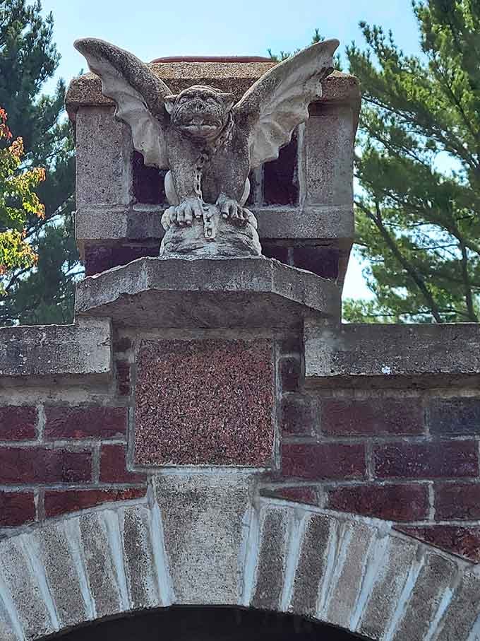 A stone gargoyle keeps watch from its perch, adding that perfect touch of Gothic atmosphere to the castle's exterior.
