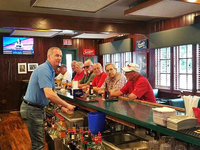 Regulars at the bar sharing stories and laughs, the kind of scene that makes you wish you'd discovered this place years ago.