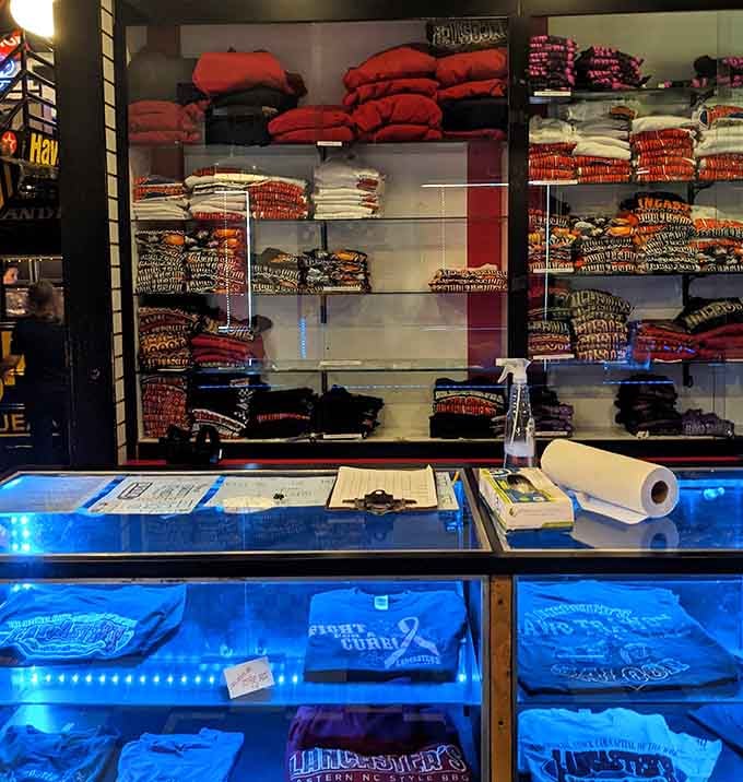 Racing merchandise displayed like trophies, because when you love NASCAR this much, you wear it with pride literally.