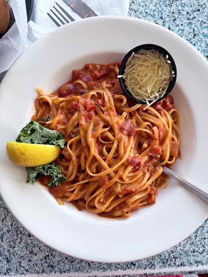 Interior dining with ocean views framed like living paintings, making every seat feel like the best table available.