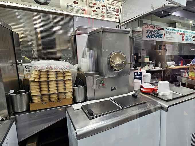 A peek inside reveals stacks of fresh cones waiting patiently, like soldiers ready to serve in the great custard wars.