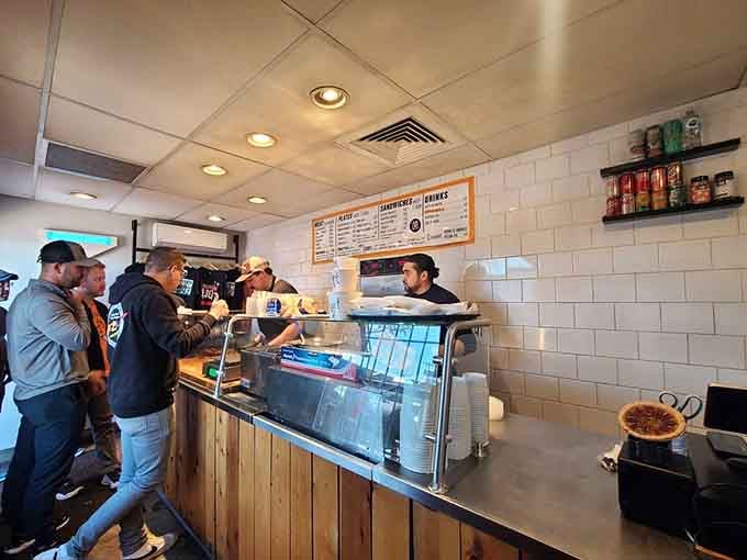 The order counter is where dreams come true and barbecue pilgrims finally claim their hard-earned rewards.