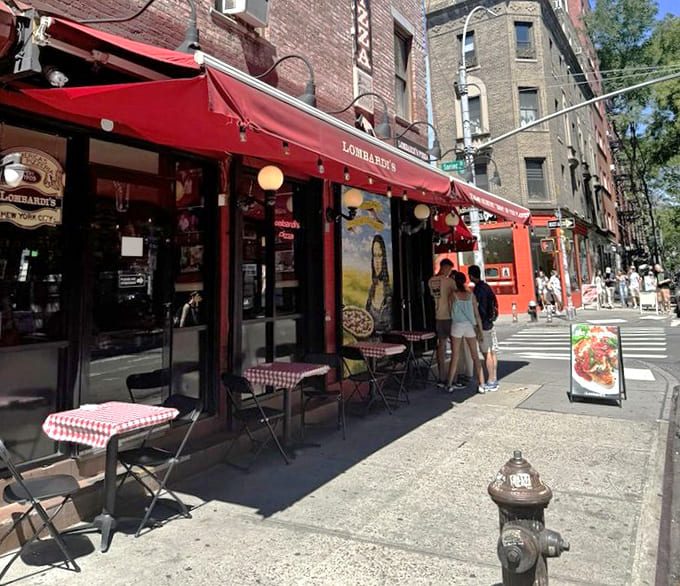 Sidewalk seating on Spring Street where you can watch Little Italy go by between delicious bites of pizza.