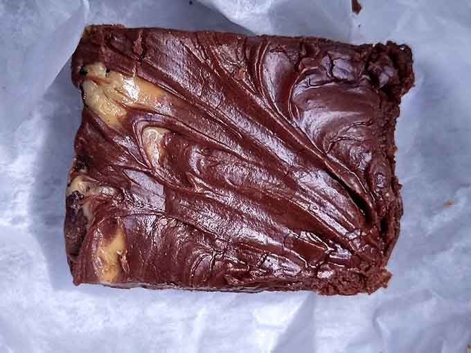 This brownie looks like it could double as a chocolate brick, dense and fudgy enough to require structural engineering.