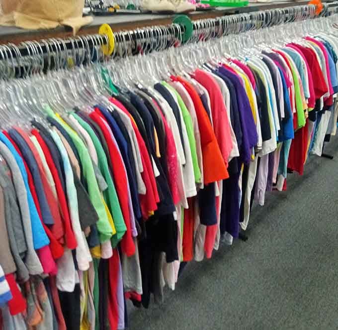 Racks of colorful shirts organized by hue like a rainbow decided to become a wardrobe, making browsing actually enjoyable.