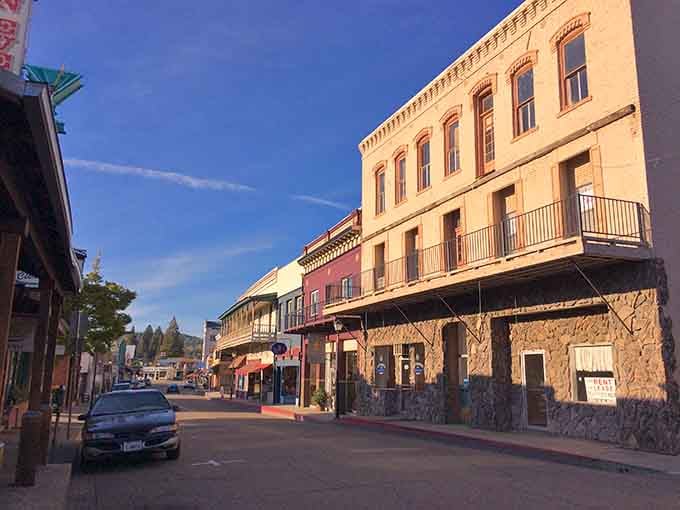 The warm glow of late afternoon sun bathes Jackson's historic buildings in golden light, a fitting tribute to the precious metal that put this town on the map.