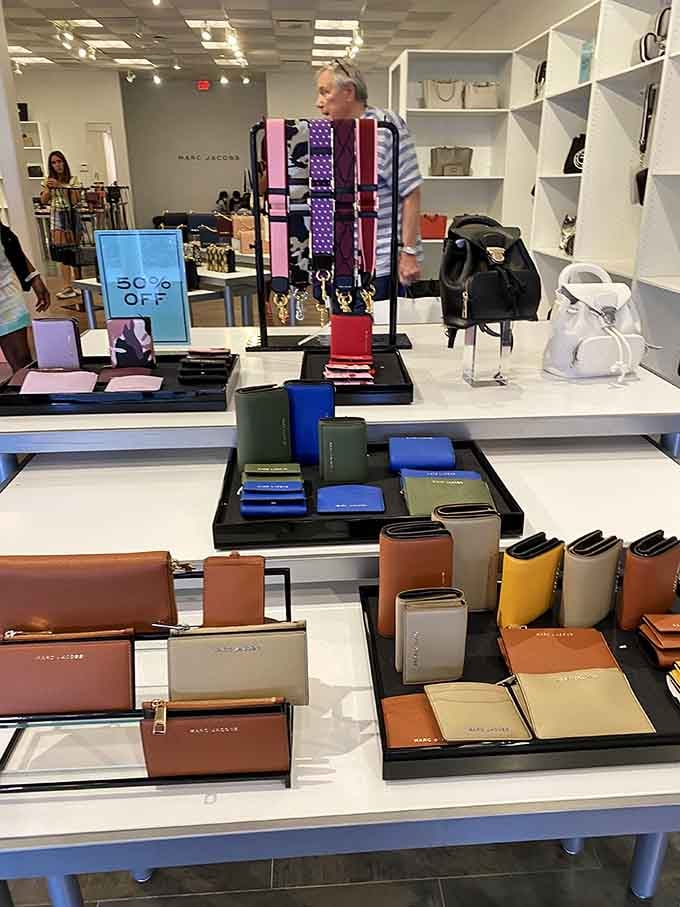 Marc Jacobs accessories displayed like museum pieces, proving that sometimes the best souvenirs come with designer labels and 50% off tags.