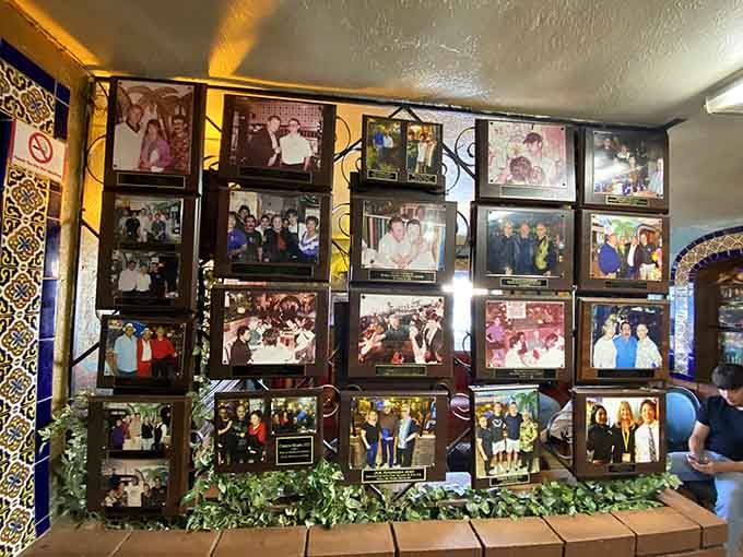 A wall of memories featuring photos of celebrities and locals alike, all united by their love for exceptional Mexican cuisine.