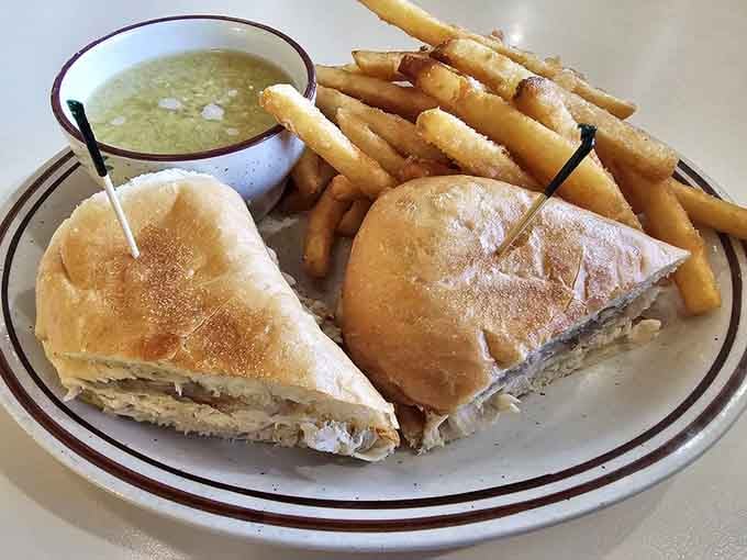 Turkey sandwich with crispy fries and soup is comfort food's way of giving you a warm hug.
