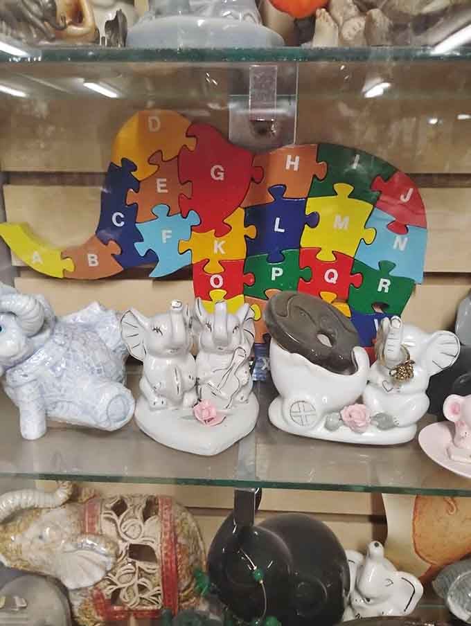A colorful alphabet puzzle elephant demonstrates the educational side of this delightfully eclectic collection of pachyderm treasures.
