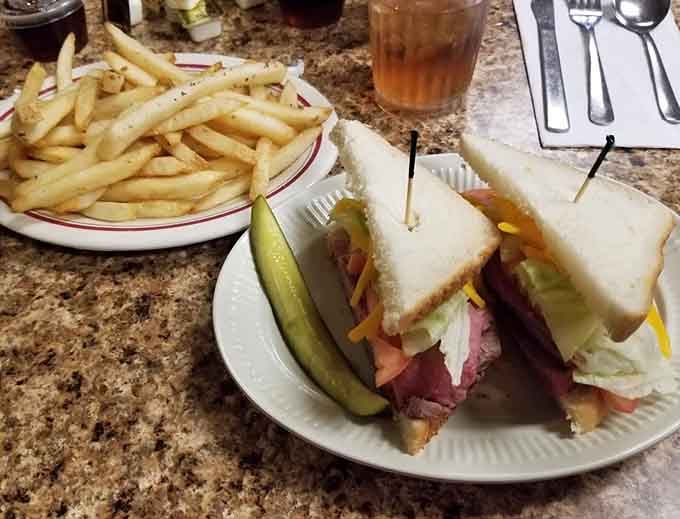 That club sandwich is stacked higher than your expectations, and somehow it still manages to exceed them completely.