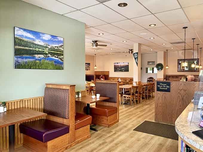 Clean, welcoming dining room with landscape photos reminding you exactly where this breakfast magic happens daily.