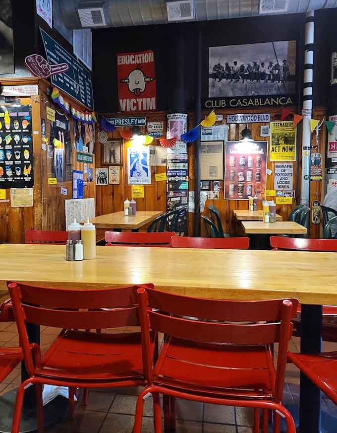 Red chairs at wooden tables create the perfect setting for burger-induced happiness and philosophical Harvard Square debates.