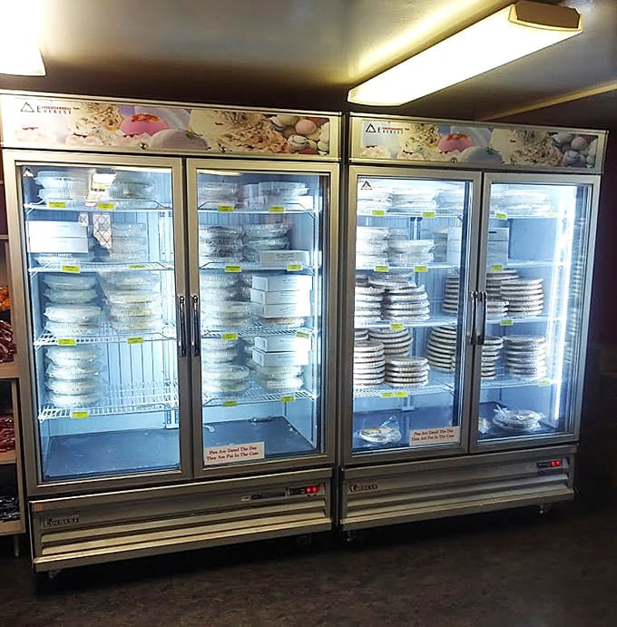 Industrial refrigerators packed with whole pies ready to go home with anyone smart enough to buy them.