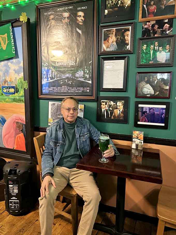 Sitting beneath the Goodfellas poster, this patron knows he's drinking where cinema legends once stood filming.