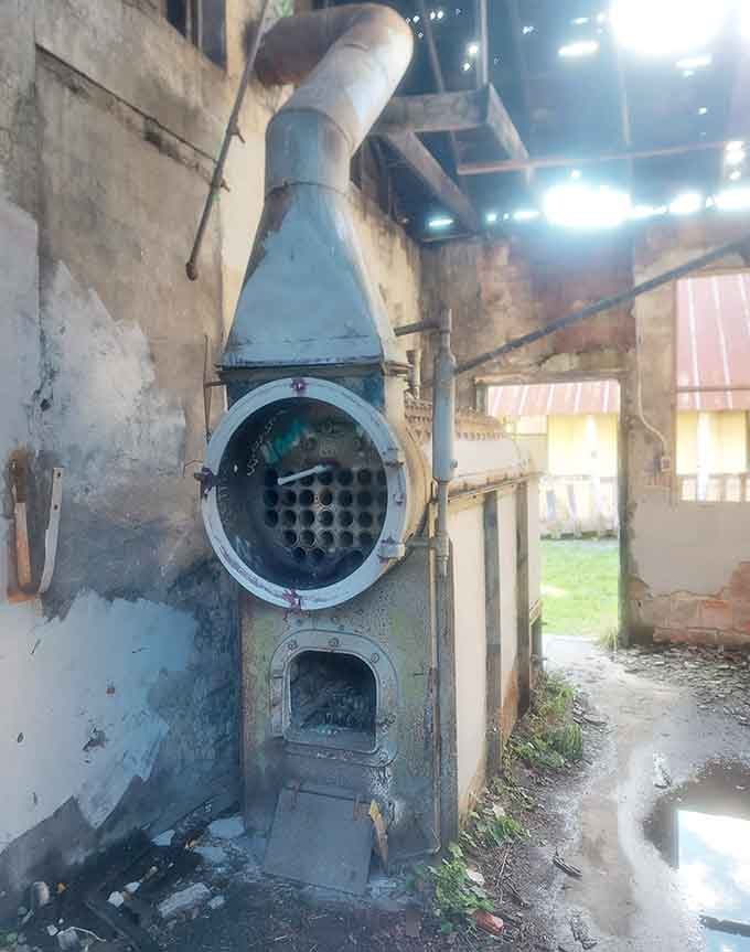 This vintage boiler system represents the industrial backbone that kept the entire farm operation running smoothly.