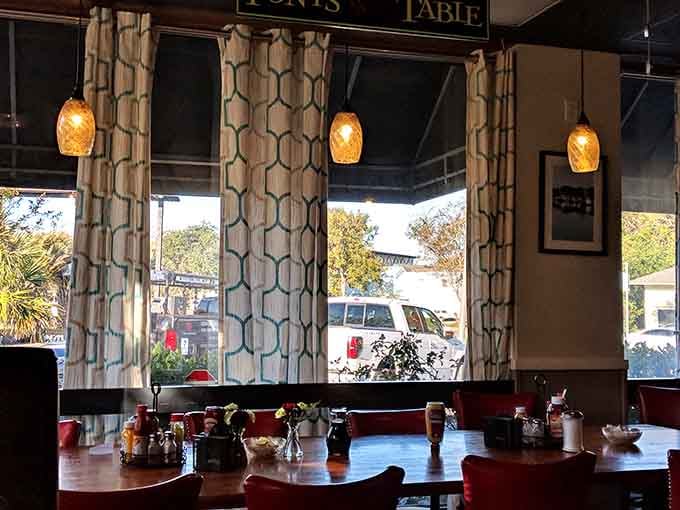 Window seats offer the perfect spot for people-watching between bites of fried chicken.