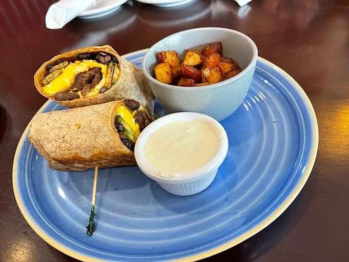The steak burrito wrap comes sliced and ready with seasoned potatoes, making lunch both satisfying and surprisingly elegant.