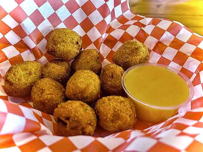 Hush puppies with honey mustard sauce are the Southern comfort food equivalent of a warm handshake and a smile.