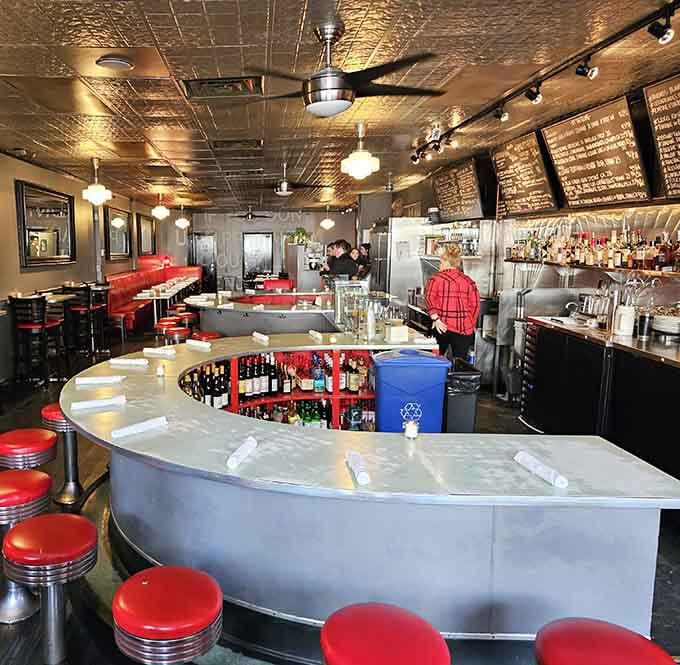 The curved counter creates an intimate dining experience where every seat feels like the best one.