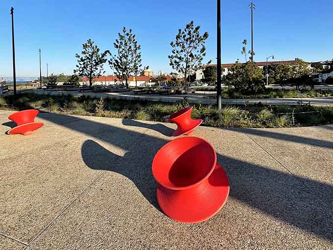 That red sculpture looks like a giant coffee cup tipped over, which feels appropriate for a city running on caffeine.